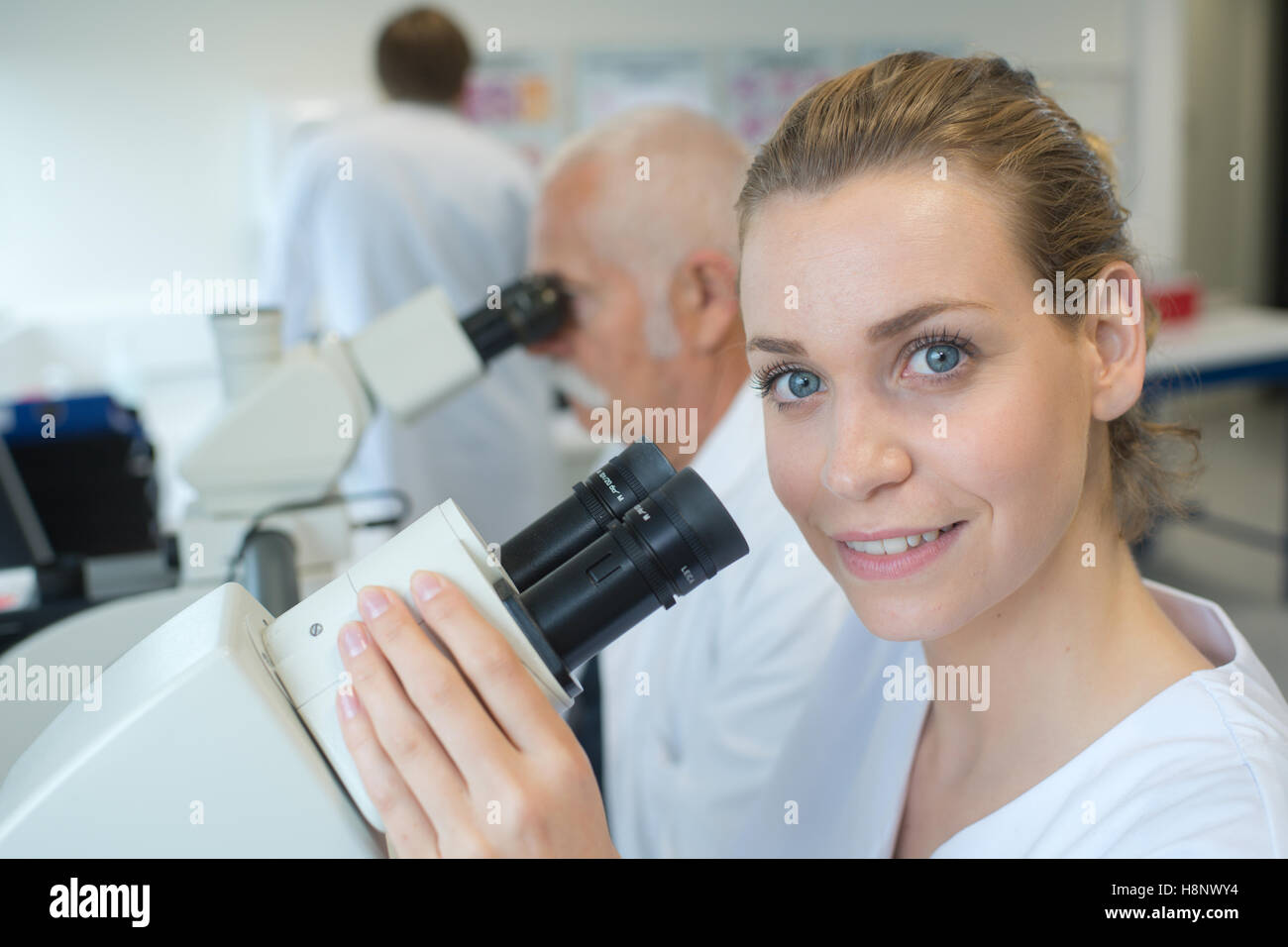 portrait of a female scientist with microscope Stock Photo - Alamy