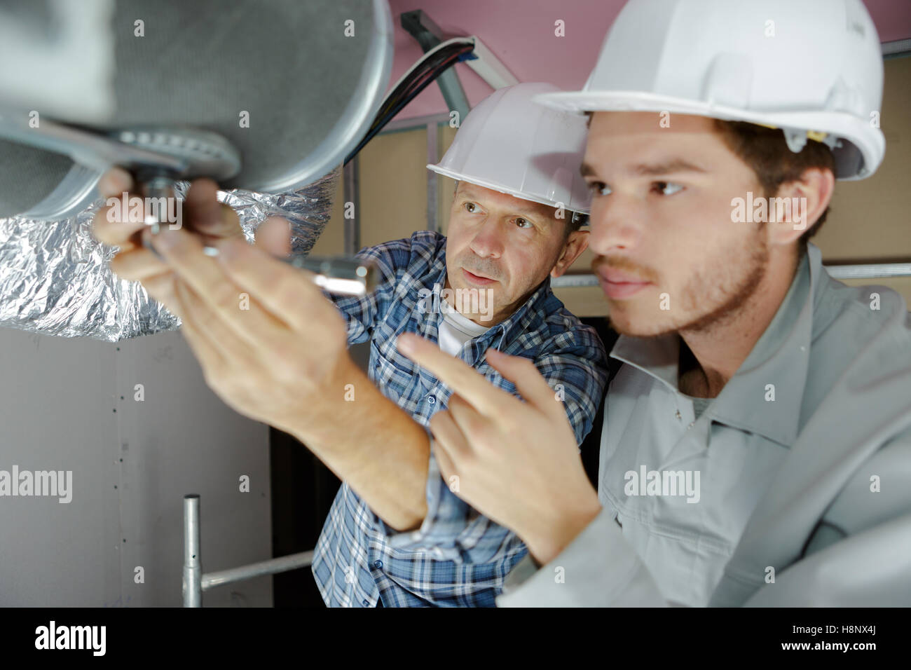 worker and coworker prepairing internal for installation Stock Photo ...