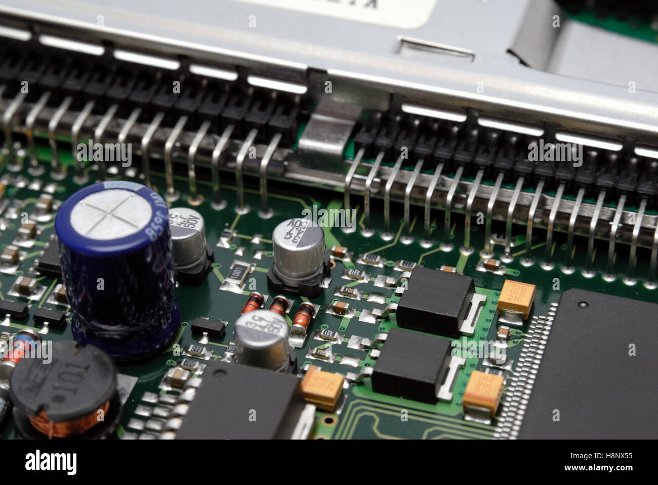 The printed-circuit-board with computer chips resistors and condensers ...