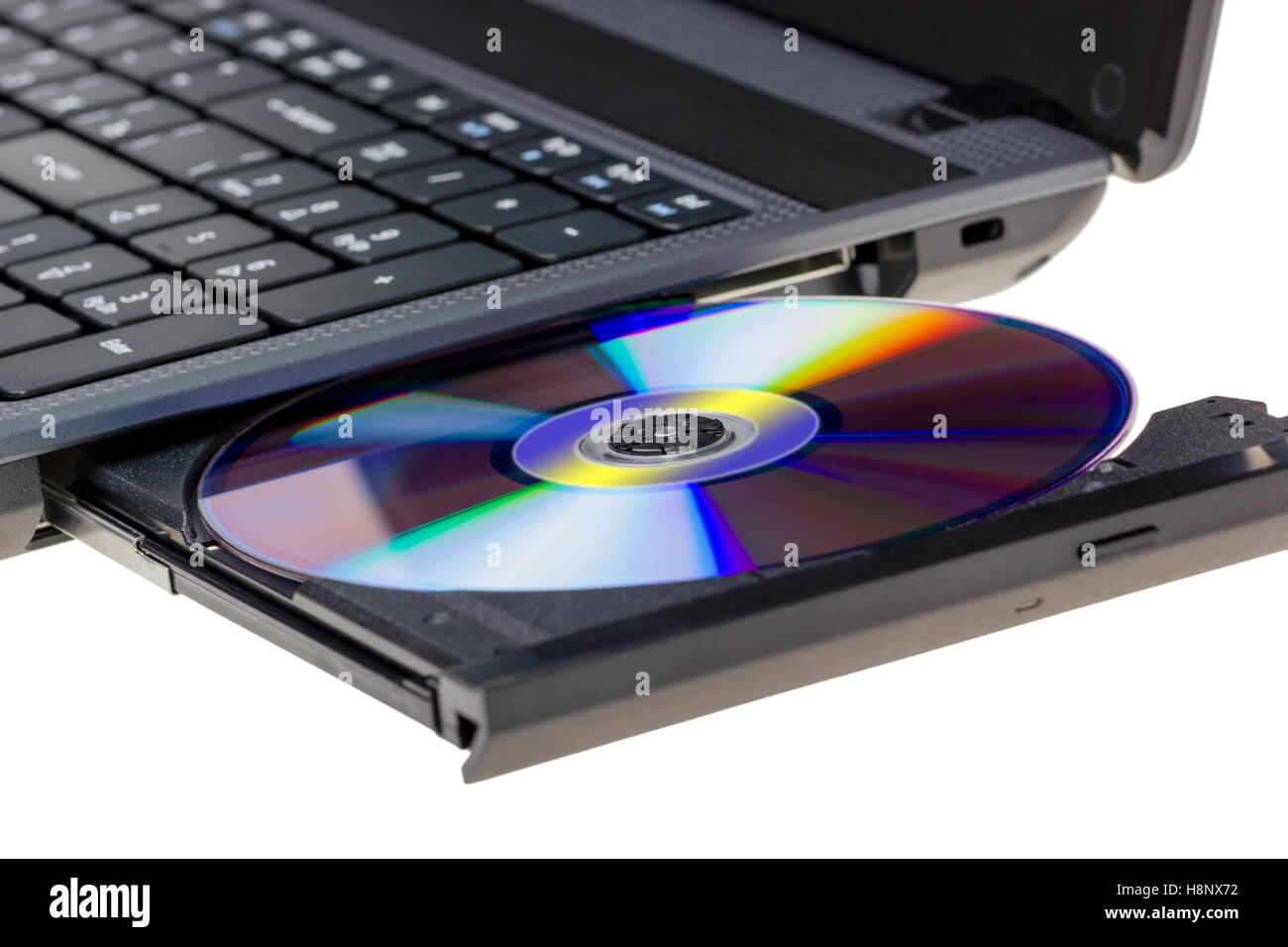 Electronic collection - Laptop with open DVD tray isolated on a white ...