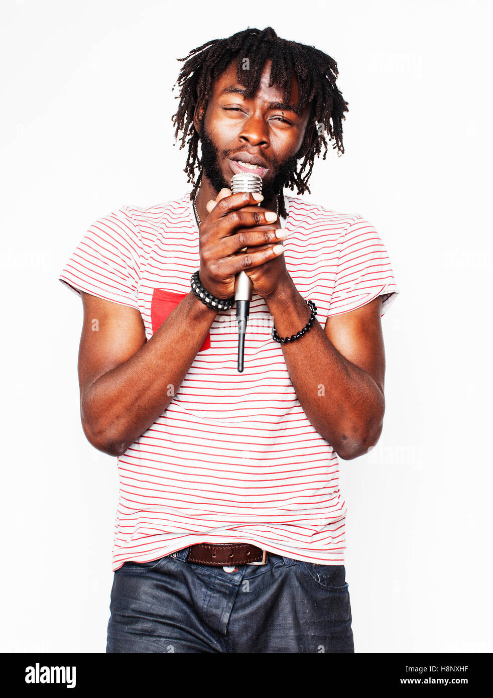 young handsome african american boy singing emotional with microphone ...