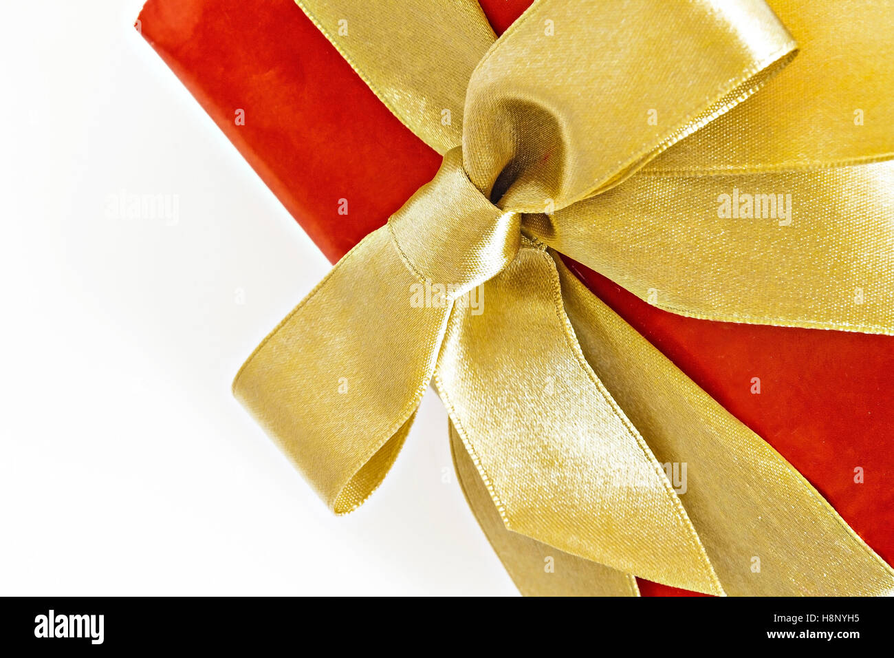 Gift red box with gold ribbon and bow isolated Stock Photo - Alamy