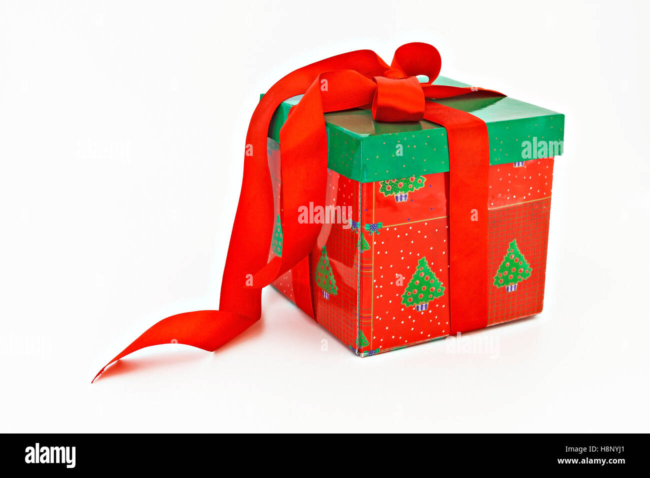 red and green Christmas gift with ribbon isolated Stock Photo - Alamy