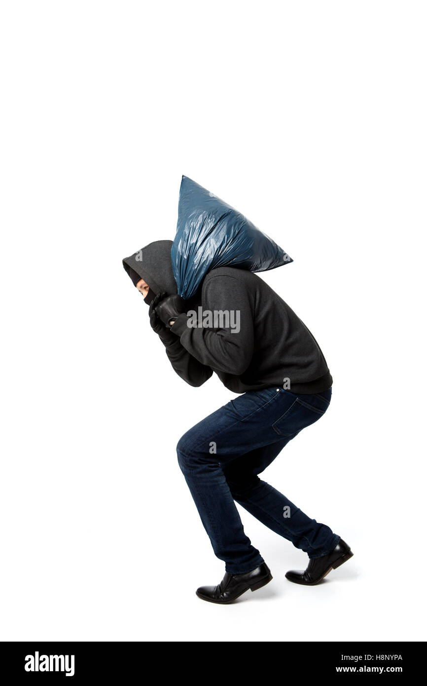 Robber slinking with large sack on pure white background Stock Photo ...