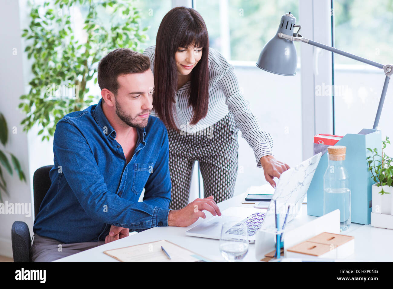 Man and Woman working in office Stock Photo - Alamy