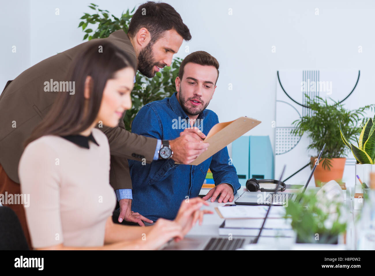 Men and Women working in office Stock Photo - Alamy