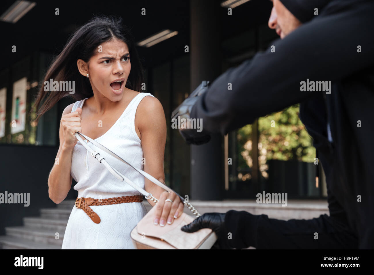 Man protecting woman hi-res stock photography and images - Alamy