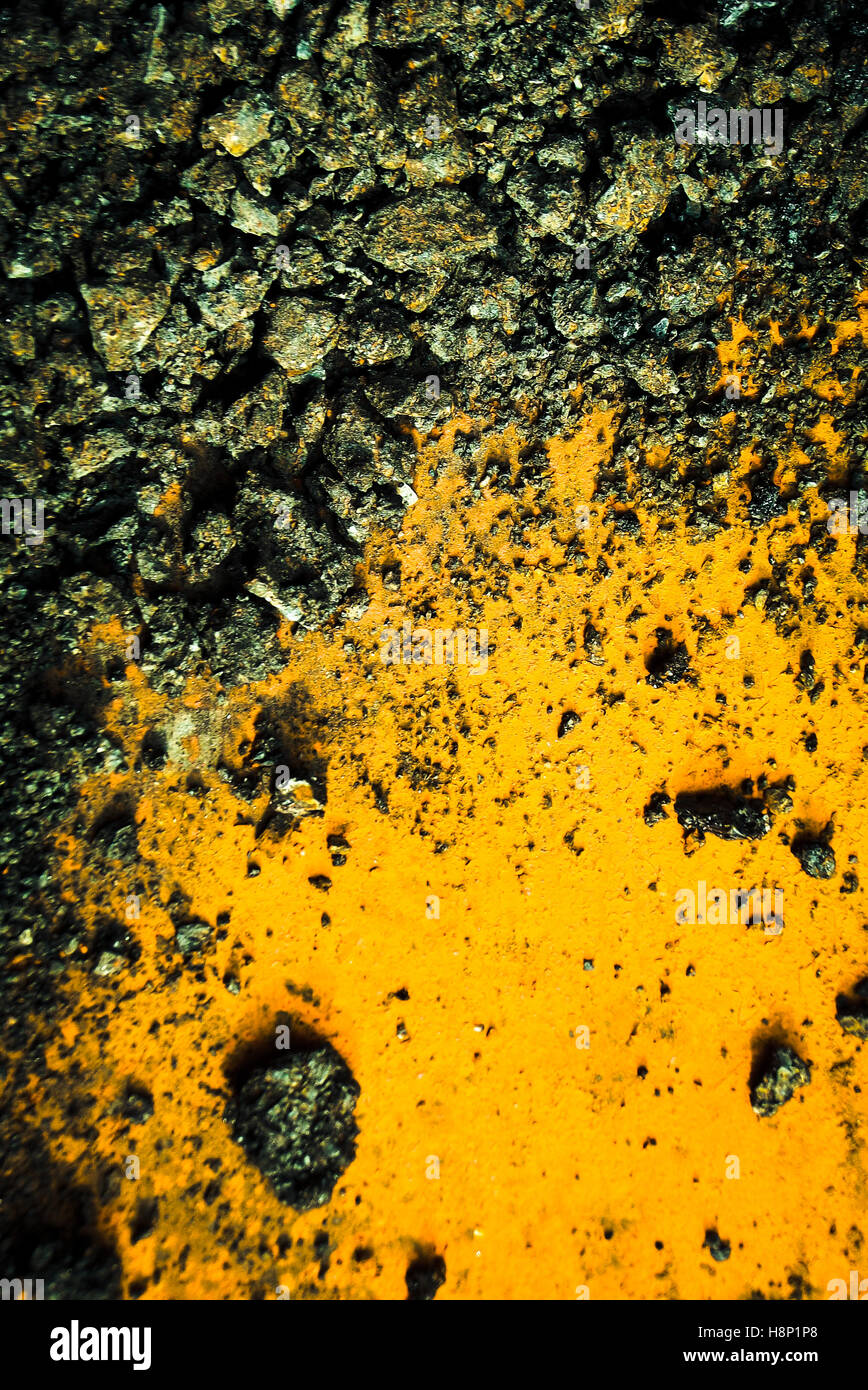 Weathered industrial yellow metal with gravel Stock Photo - Alamy