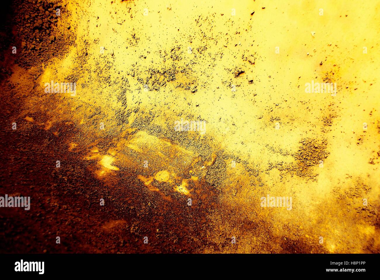 Weathered industrial gold colored metal with gravel Stock Photo - Alamy