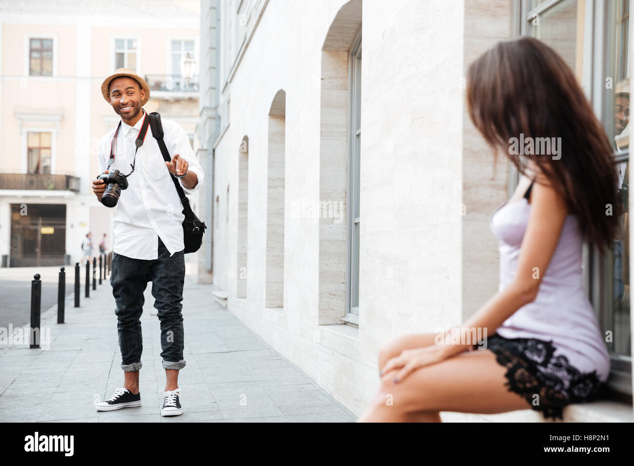 Black man photographed fashion model on the street Stock Photo - Alamy