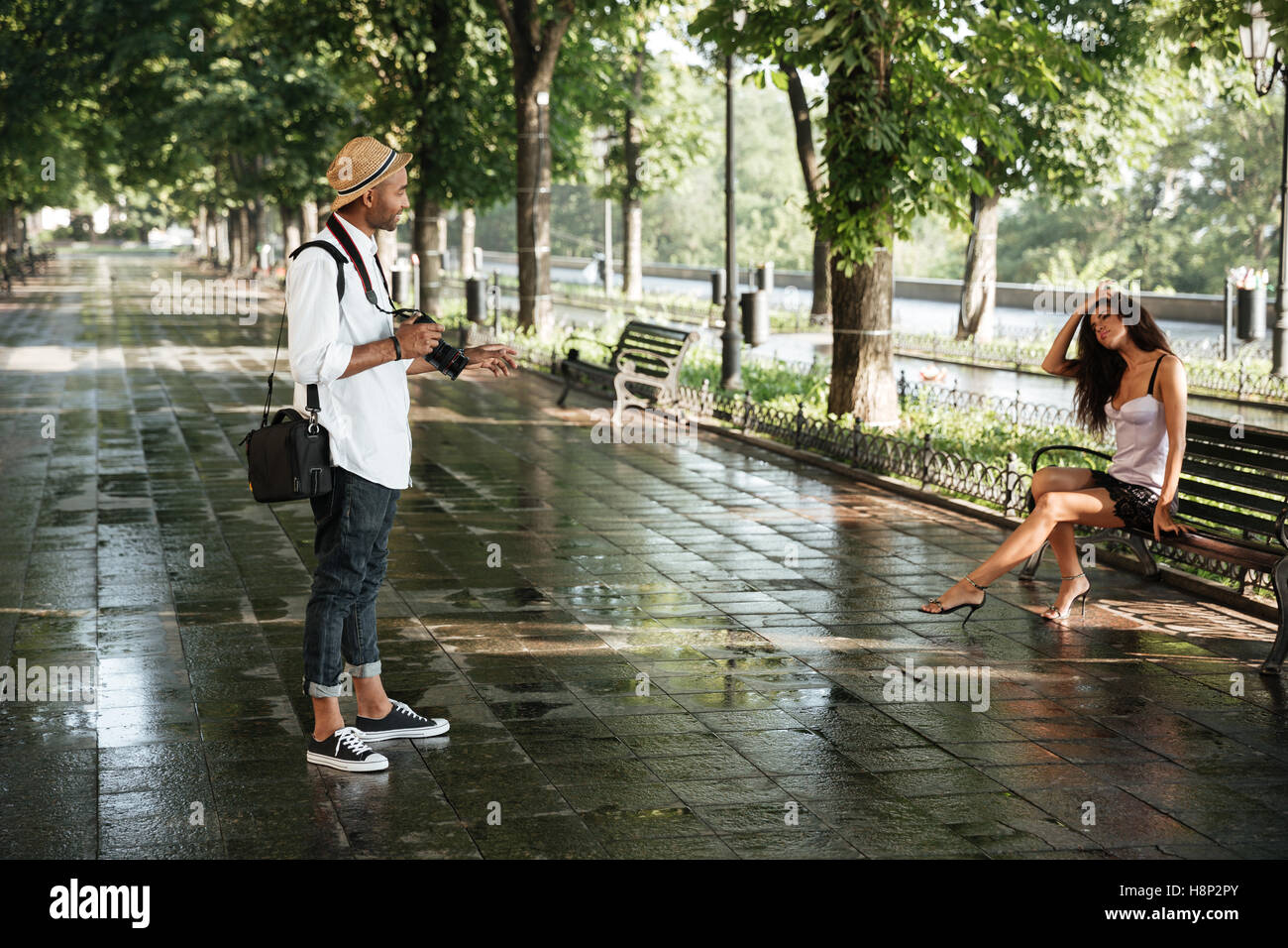 Photo session in park. with african photographer Stock Photo - Alamy