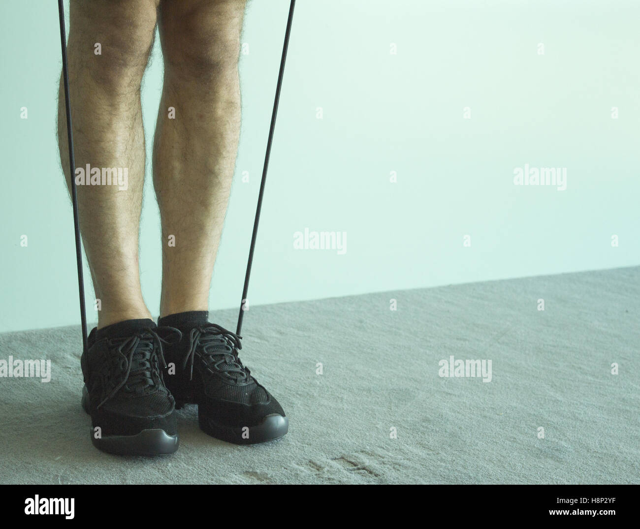 Performing exercises with resistance rope fitness Stock Photo - Alamy