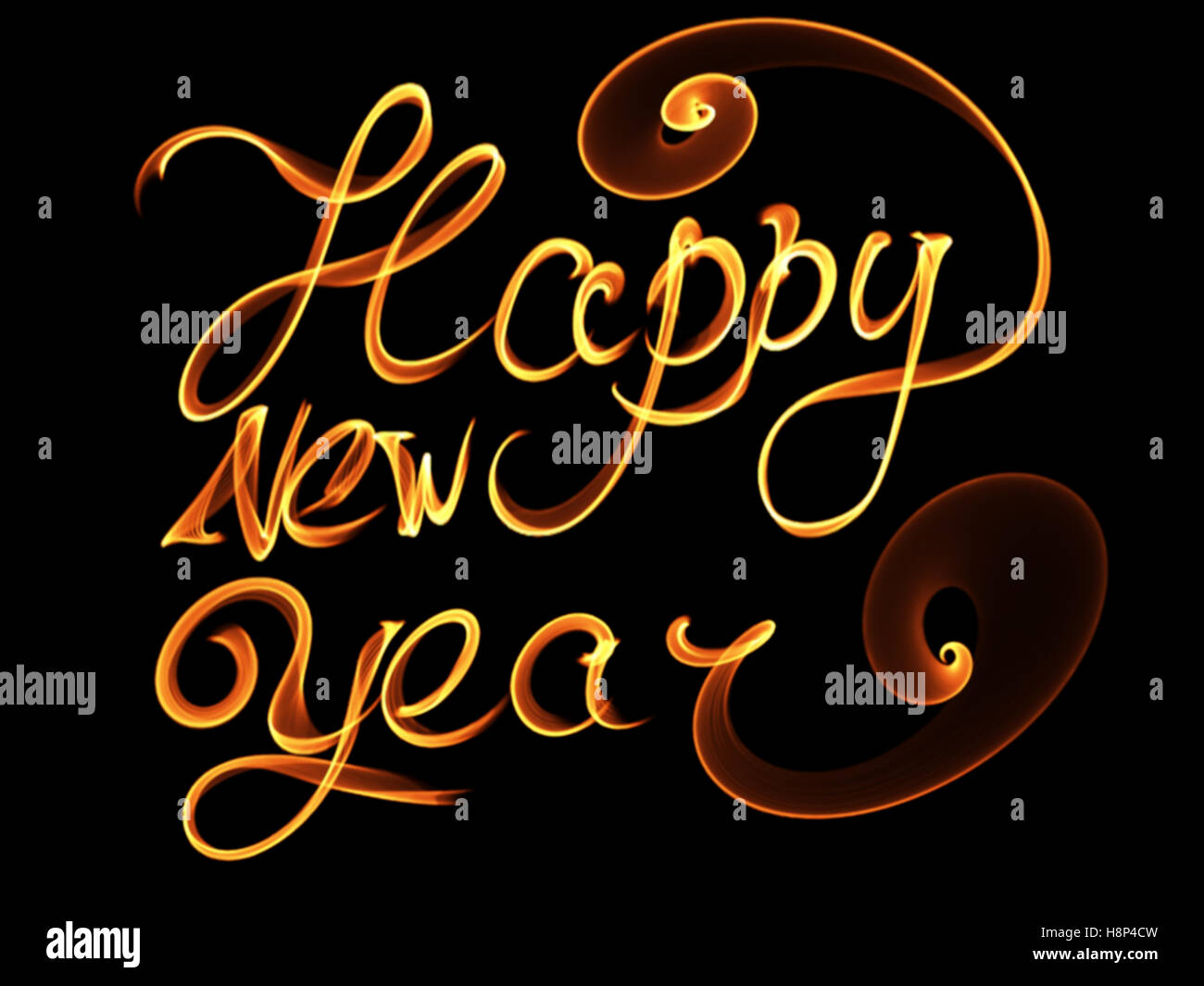 Happy new year isolated words lettering written with fire flame or ...