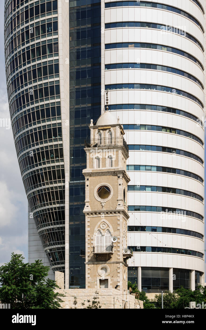 The Al-Jarina Mosque (the big mosque) and its clock tower, with modern ...