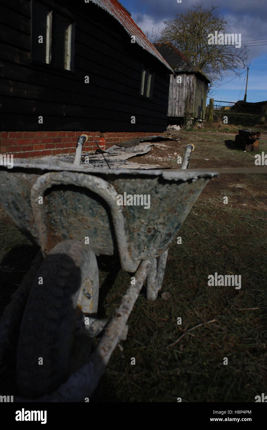 wheelbarrow outside a barn in the countryside rustic pub shot Stock ...