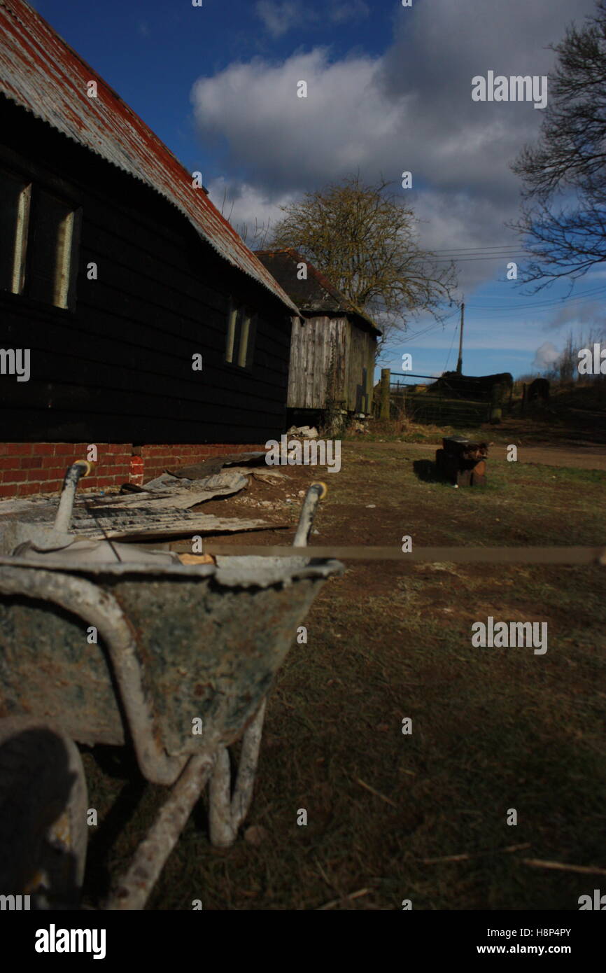 wheelbarrow outside a barn in the countryside rustic pub shot Stock ...