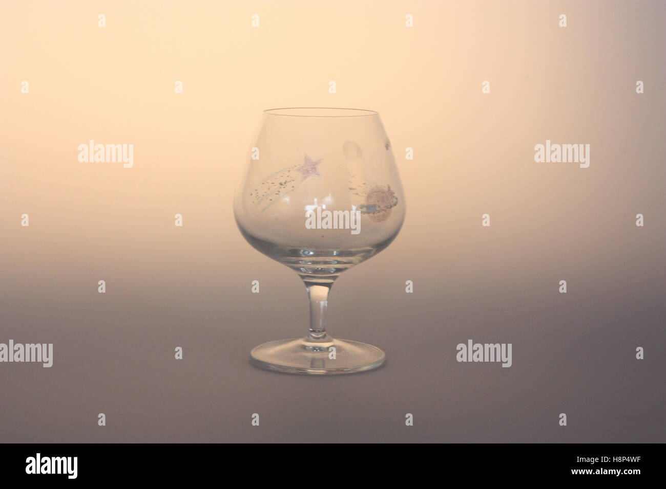 glass with moon and stars on - still life - light box Stock Photo - Alamy