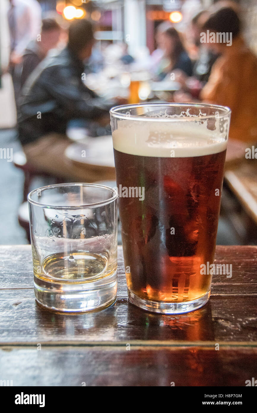 Dublin, Ireland- A glass of beer in a local pub in the city of Dublin ...