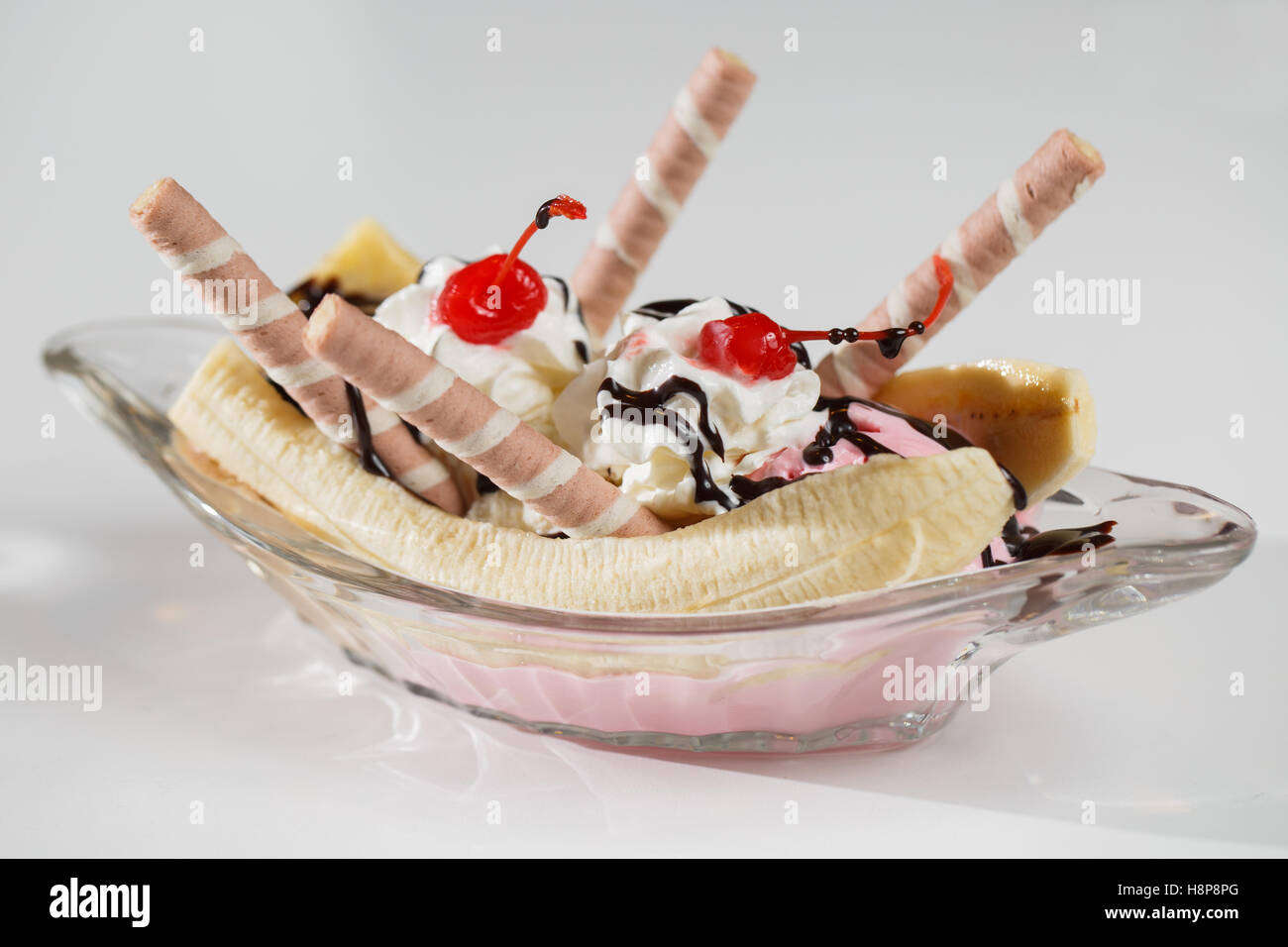 Banana split, and ice cream dessert with toppings Stock Photo - Alamy