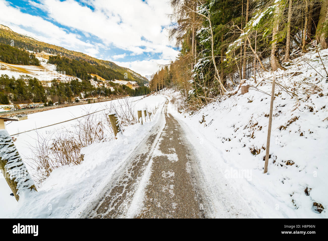 snowy mountain road in the Alps Stock Photo - Alamy