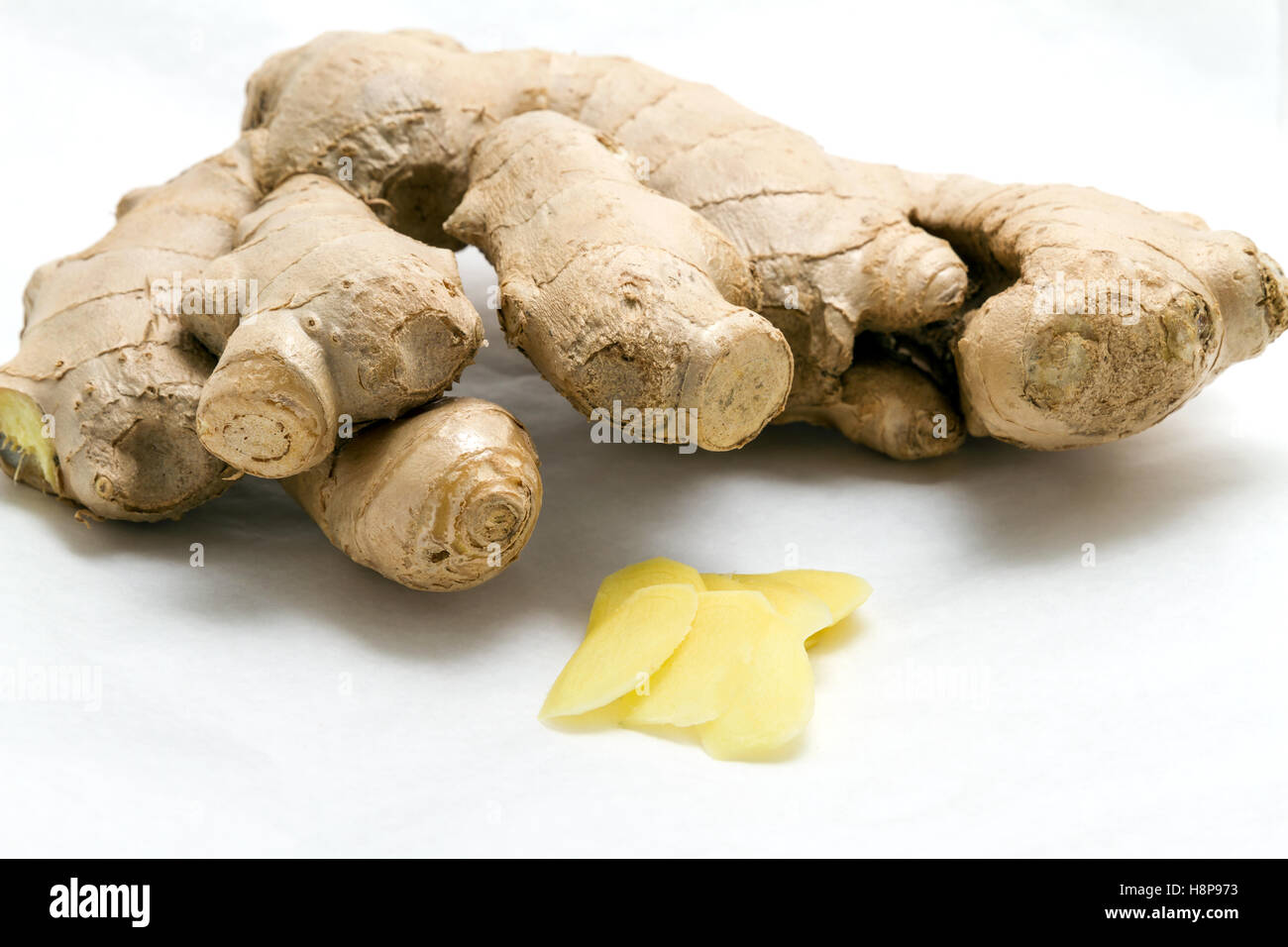 ginger root closeup on white background Stock Photo - Alamy