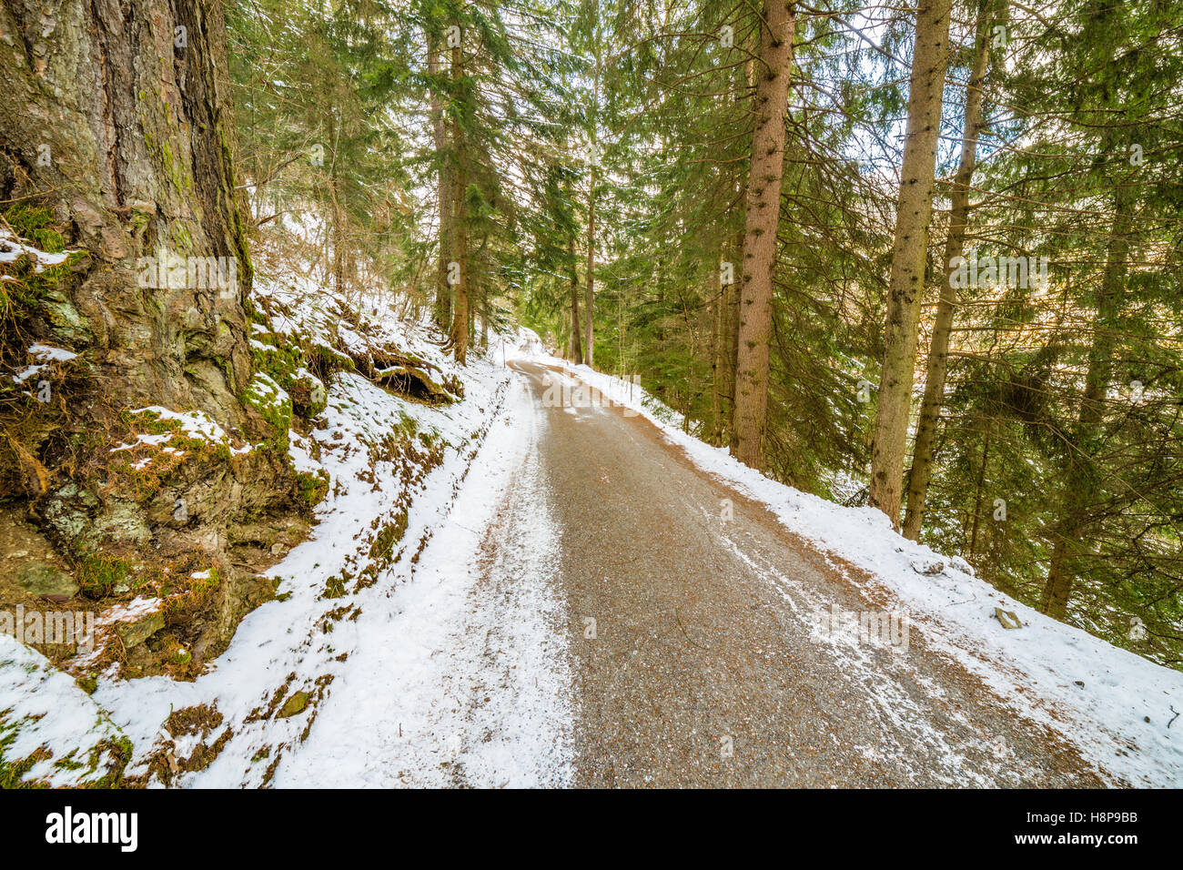 snowy mountain road in the Alps Stock Photo - Alamy
