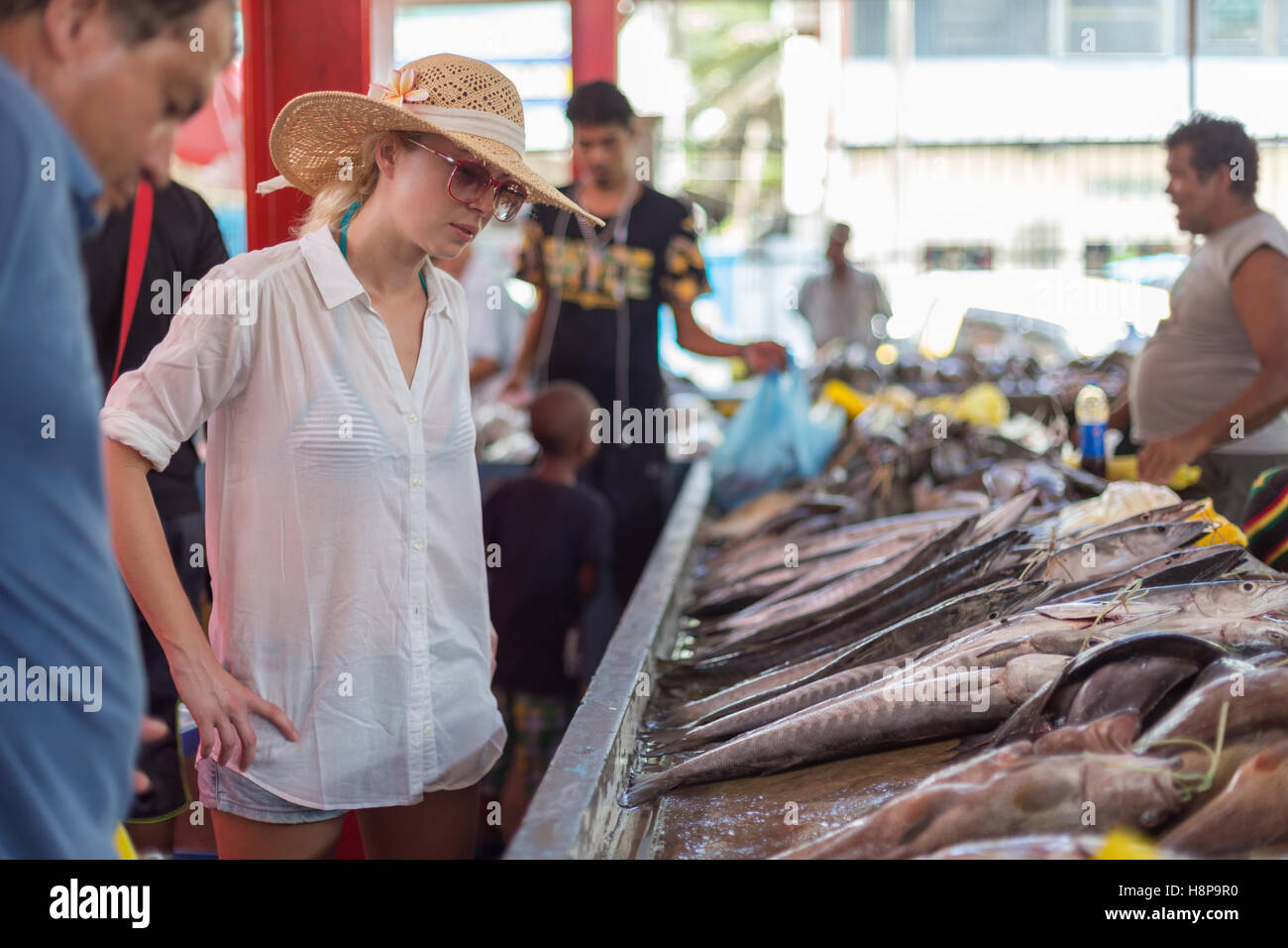 Traveler shopping on traditional Victoria fish market, Seychelles Stock ...