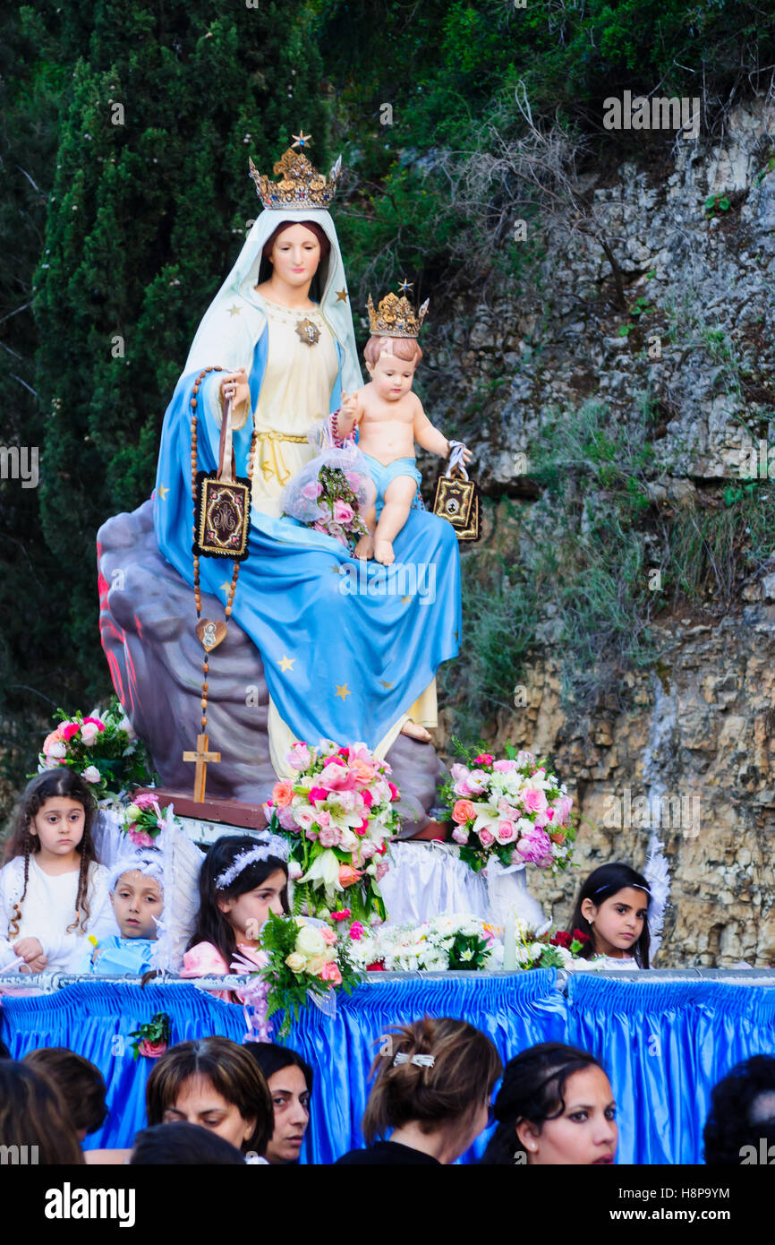 HAIFA, ISRAEL - APR 19, 2015: The statue of Mary is carried up by the ...