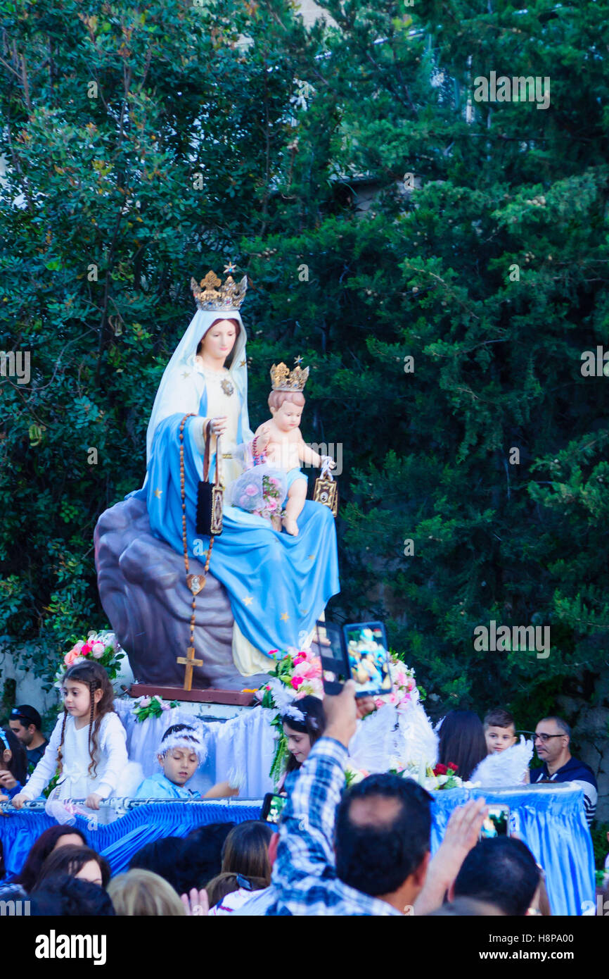 HAIFA, ISRAEL - APR 19, 2015: The statue of Mary is carried up by the ...