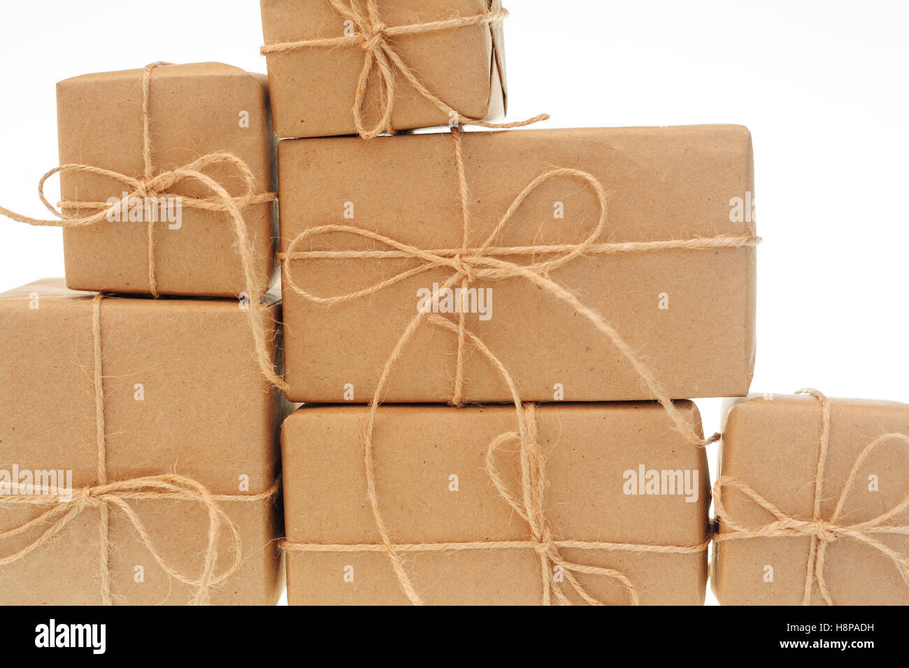 kraft paper tied with string on a white background Stock Photo - Alamy