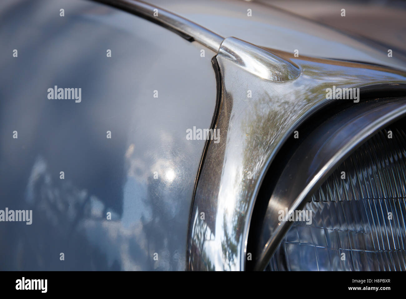 Retro styled image of a front of blue classic car Stock Photo - Alamy