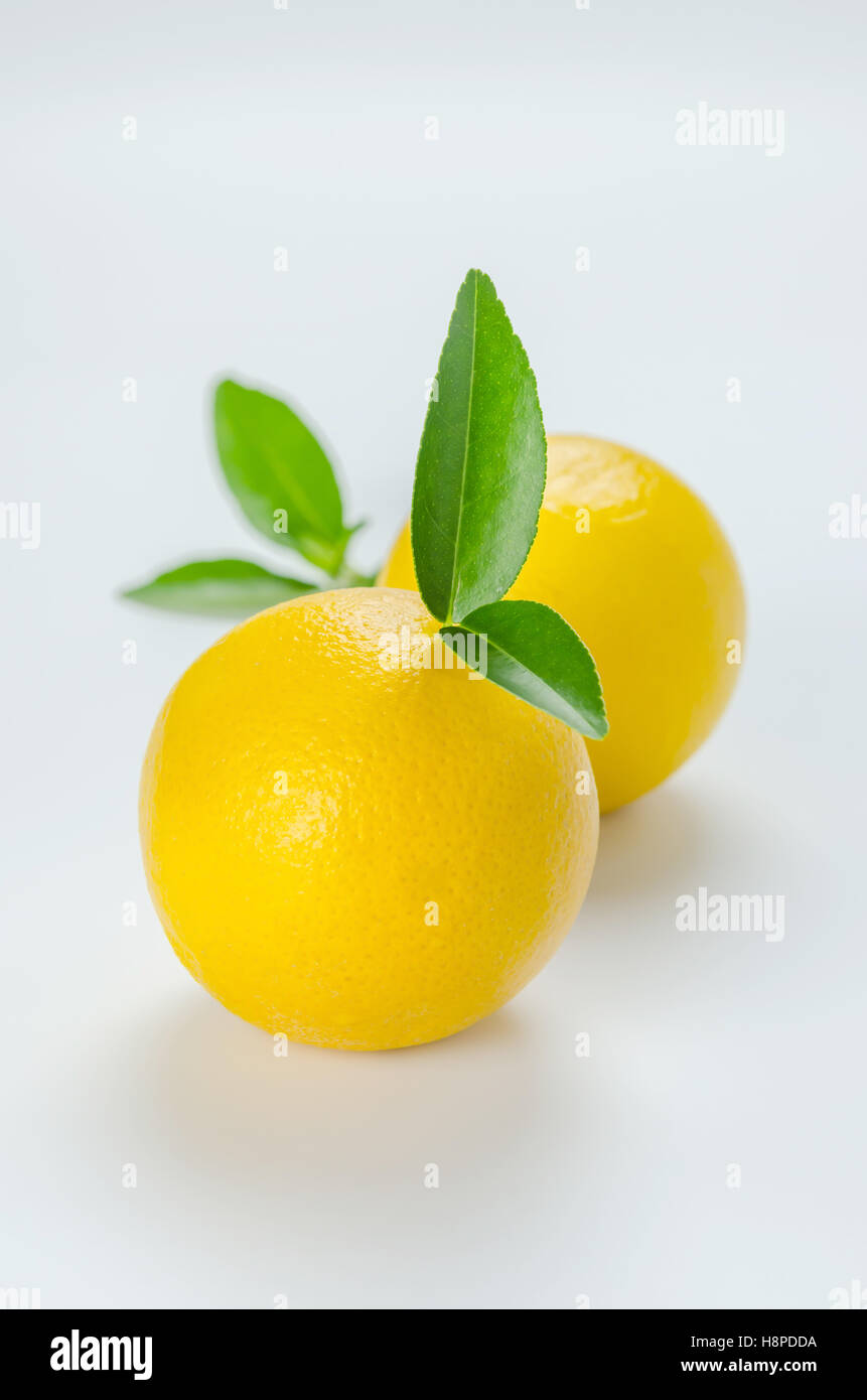 ripe orange with leaves on white background Stock Photo - Alamy