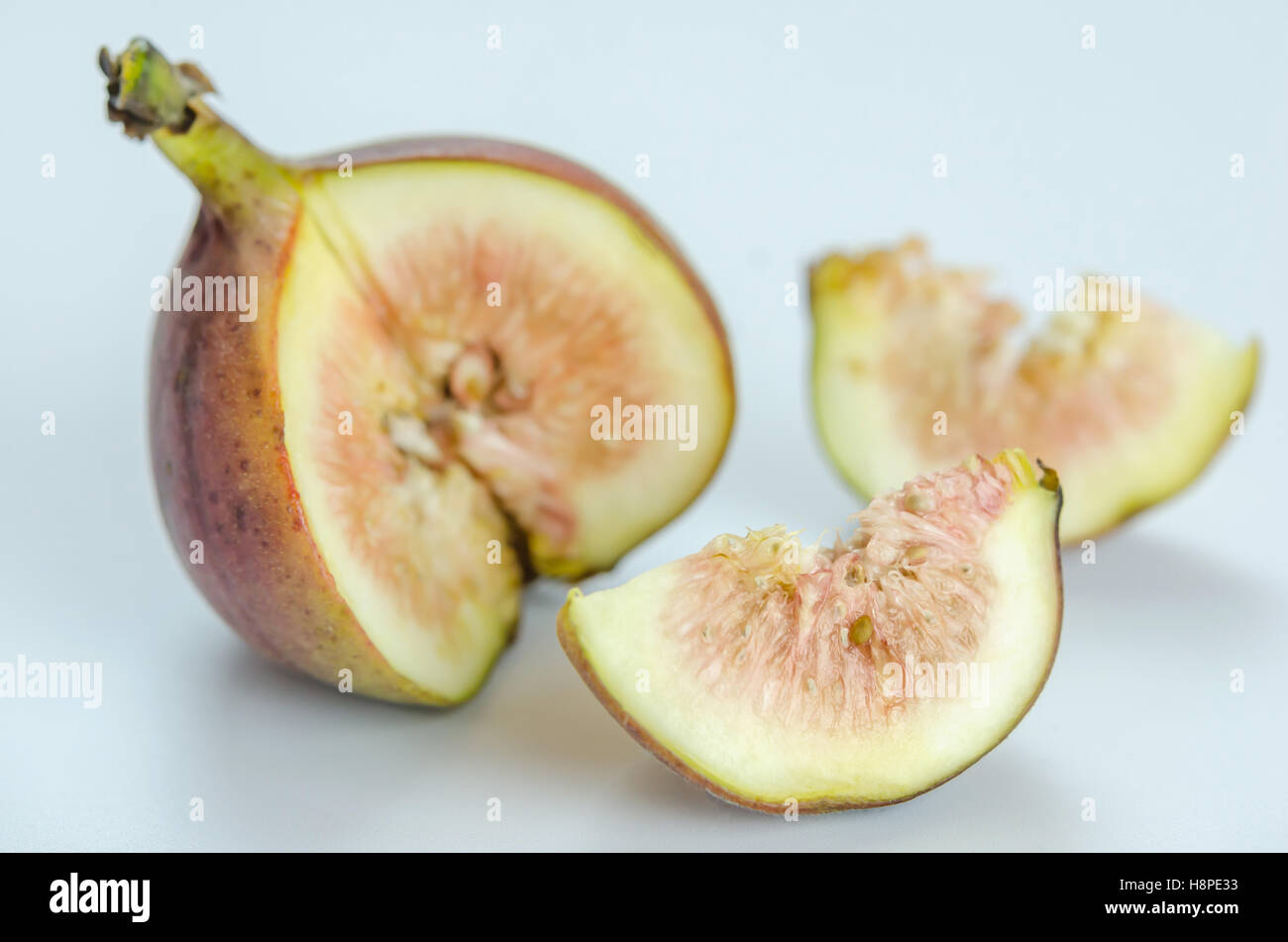 sliced fresh figs fruit on white background Stock Photo - Alamy