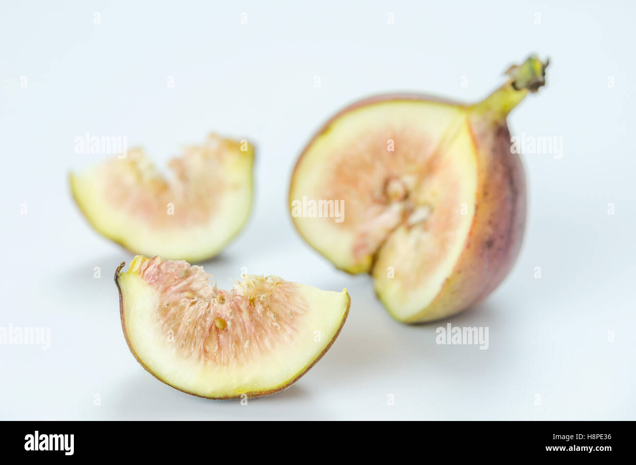 sliced fresh figs fruit on white background Stock Photo - Alamy