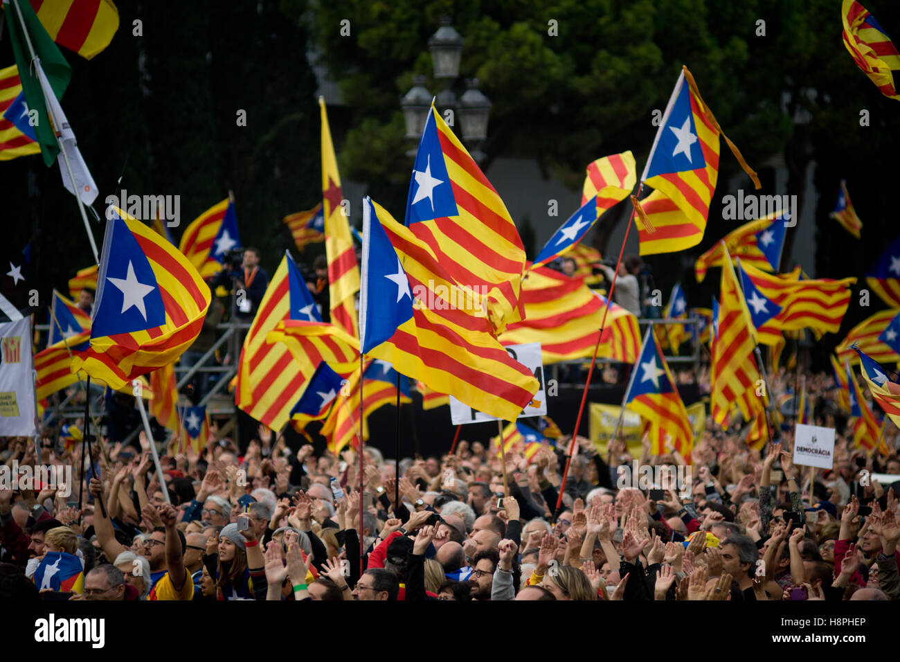 Pro independence supporters wave estelades ( independence flags) during ...