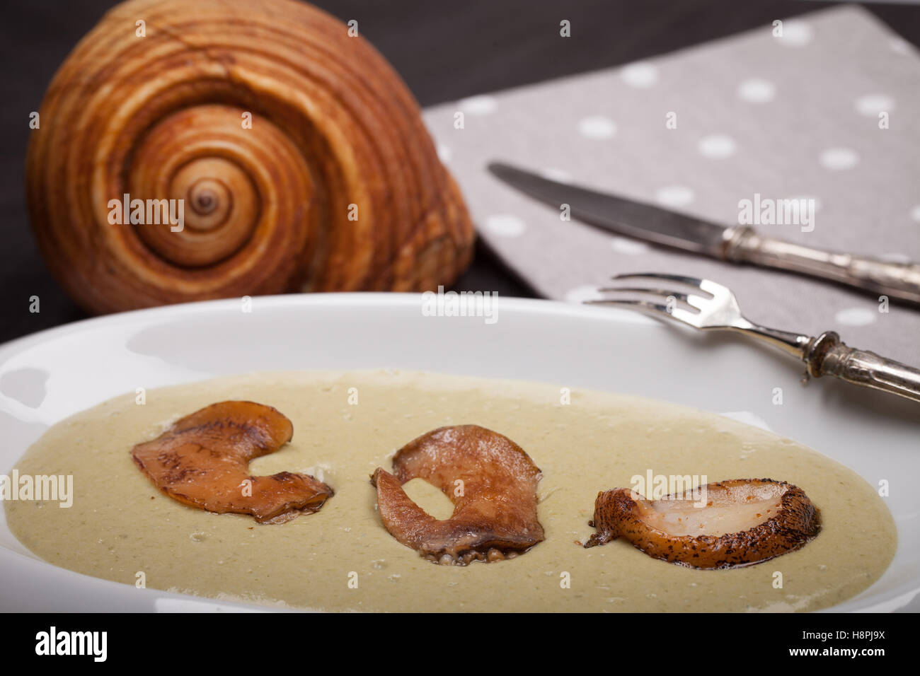 Fried Giant Tun Snails Dish Stock Photo - Alamy