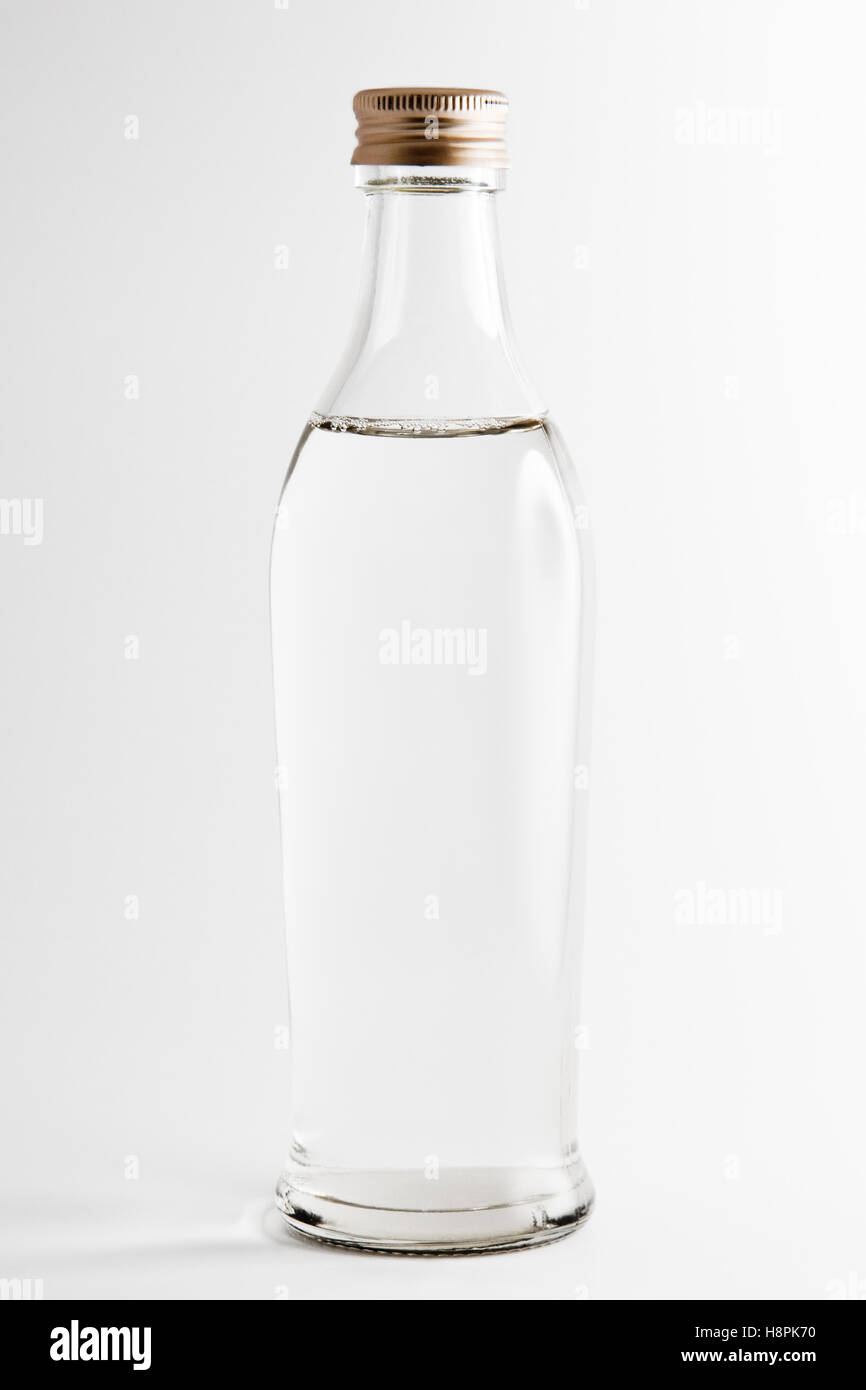 Glass Bootle filled with water Stock Photo - Alamy