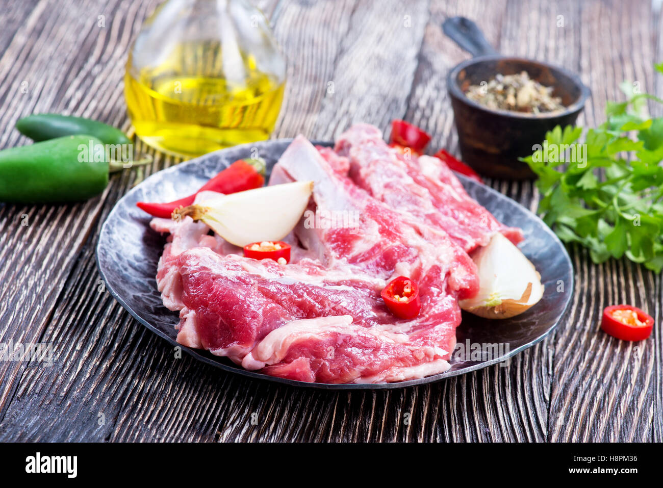 raw meat with salt and spice, raw meat on a table Stock Photo - Alamy