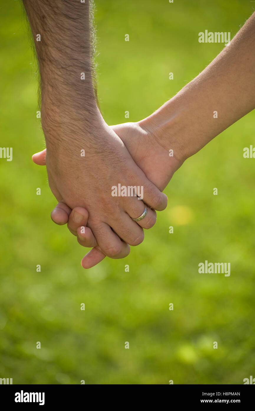 Hand in hand Stock Photo - Alamy