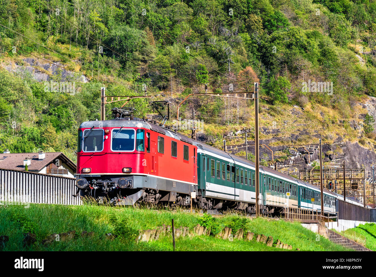 Passenger train is climbing up the Gotthard pass - Switzerland Stock ...