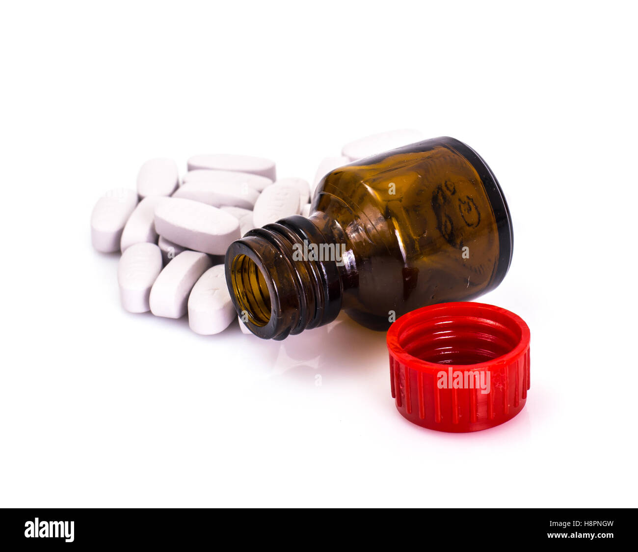 Colored capsules, pills and medical glass bottle Stock Photo - Alamy