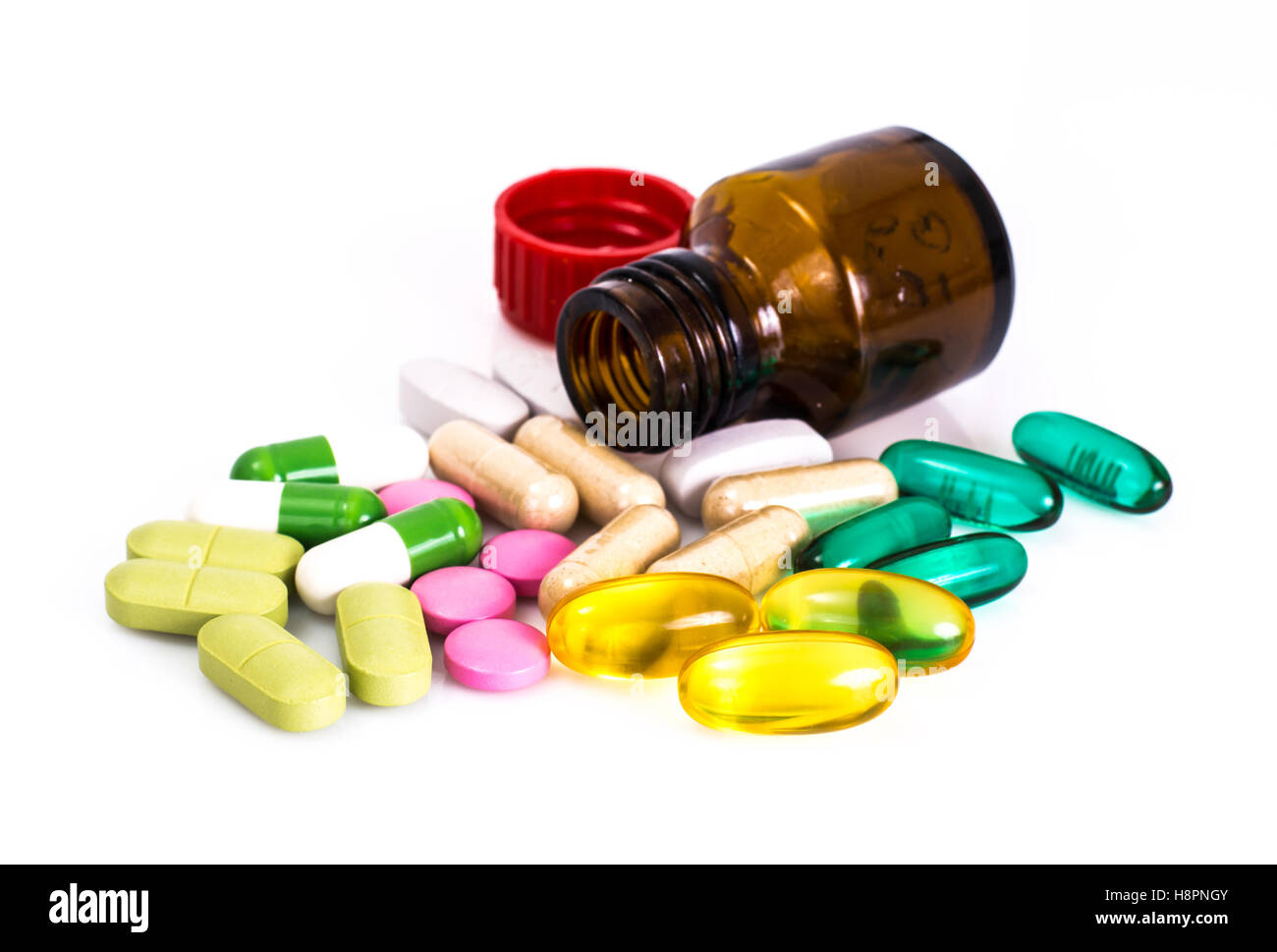 Colored capsules, pills and medical glass bottle Stock Photo - Alamy