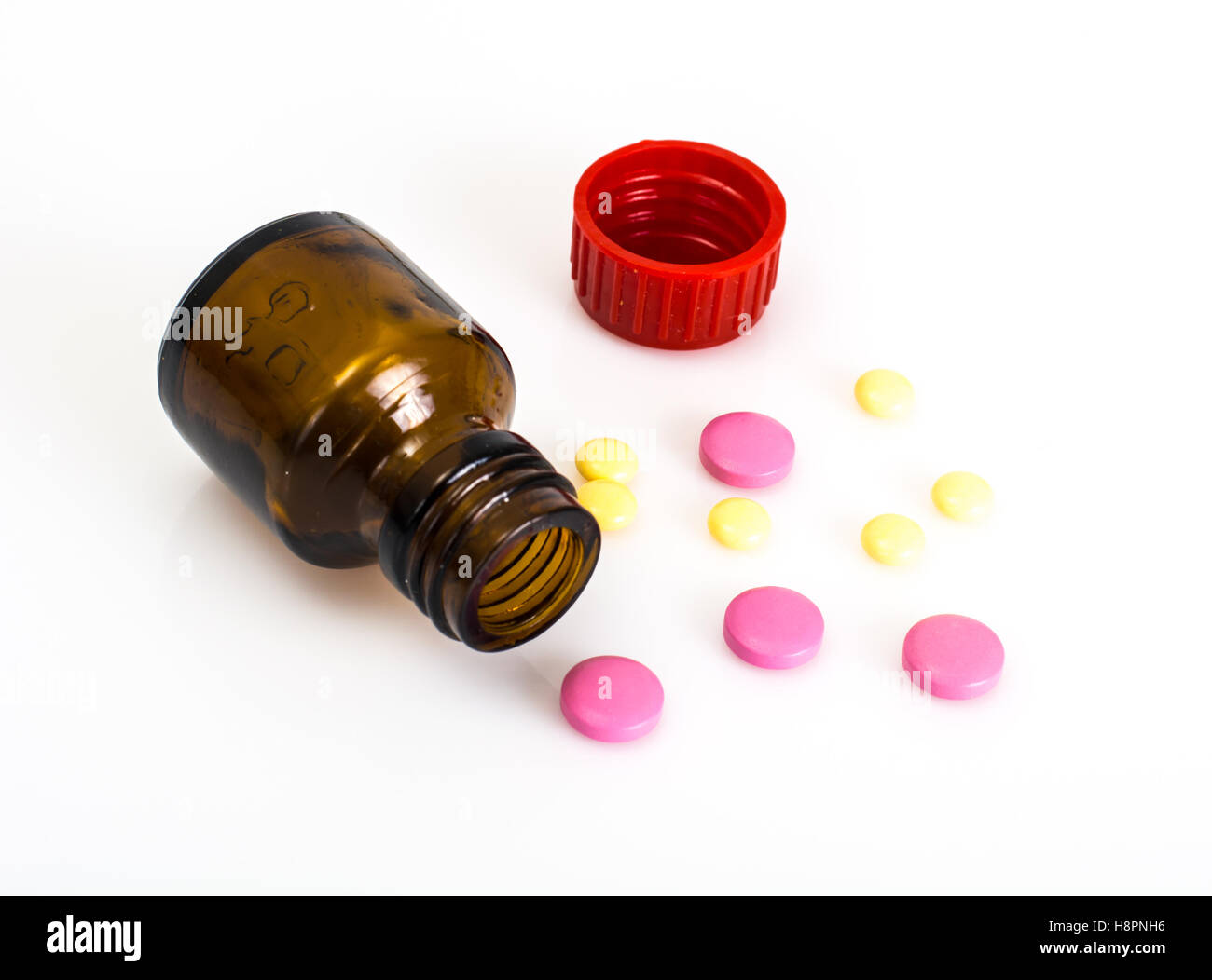 Colored capsules, pills and medical glass bottle Stock Photo - Alamy