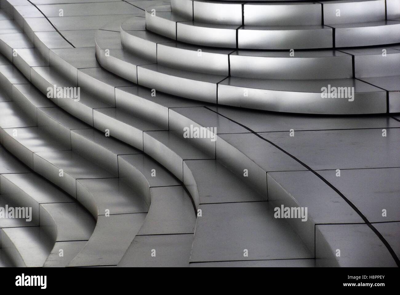 Silver colored steps and pillar base Stock Photo - Alamy