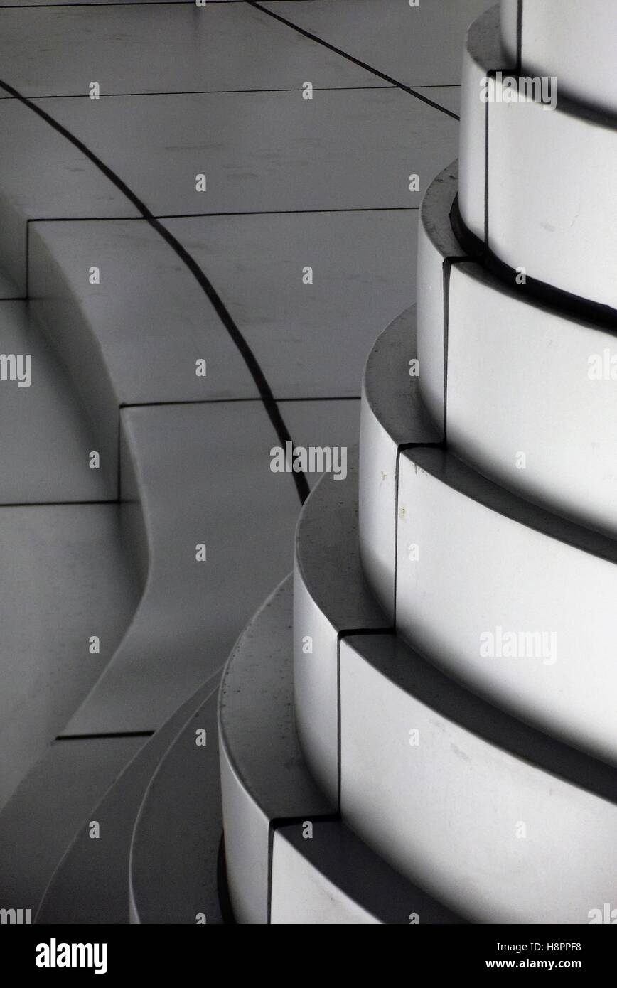 Silver colored steps and pillar. Vertical format Stock Photo - Alamy