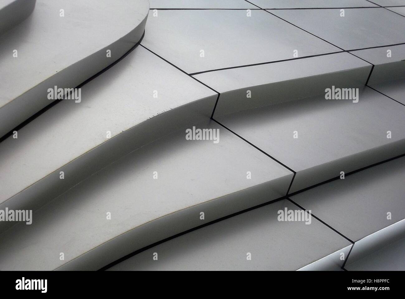Silver colored steps and pillar base Stock Photo - Alamy