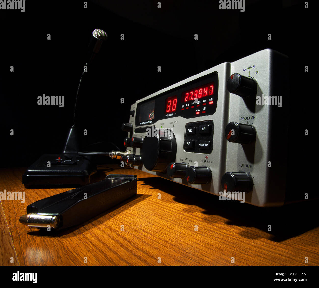 Loaded handgun magazine with a radio and microphone Stock Photo - Alamy