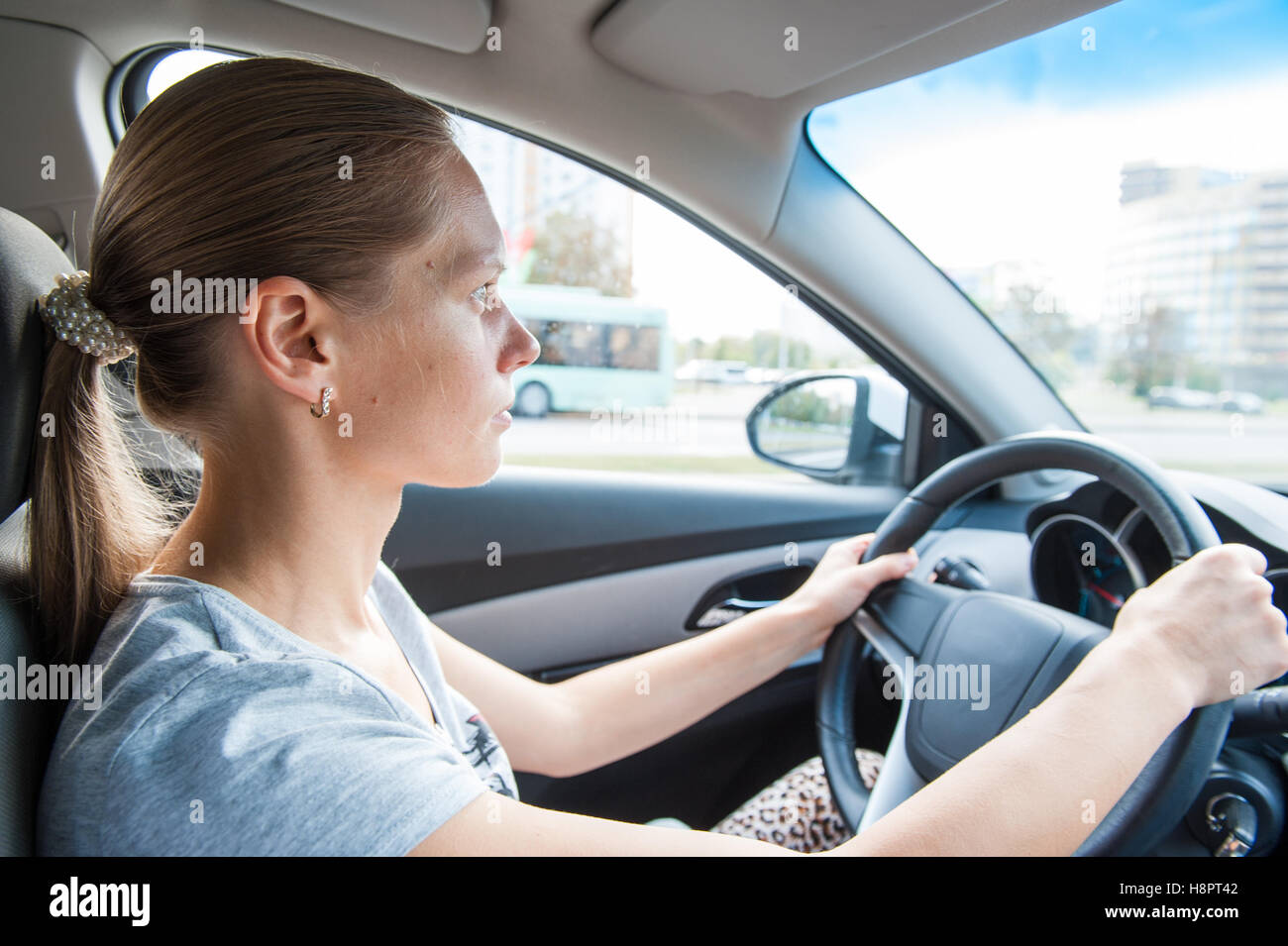 one white blond attractive young woman drives a car Stock Photo - Alamy