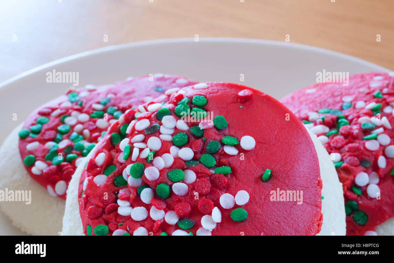 Bright cookies that have red frosting and green sprinkles Stock Photo ...