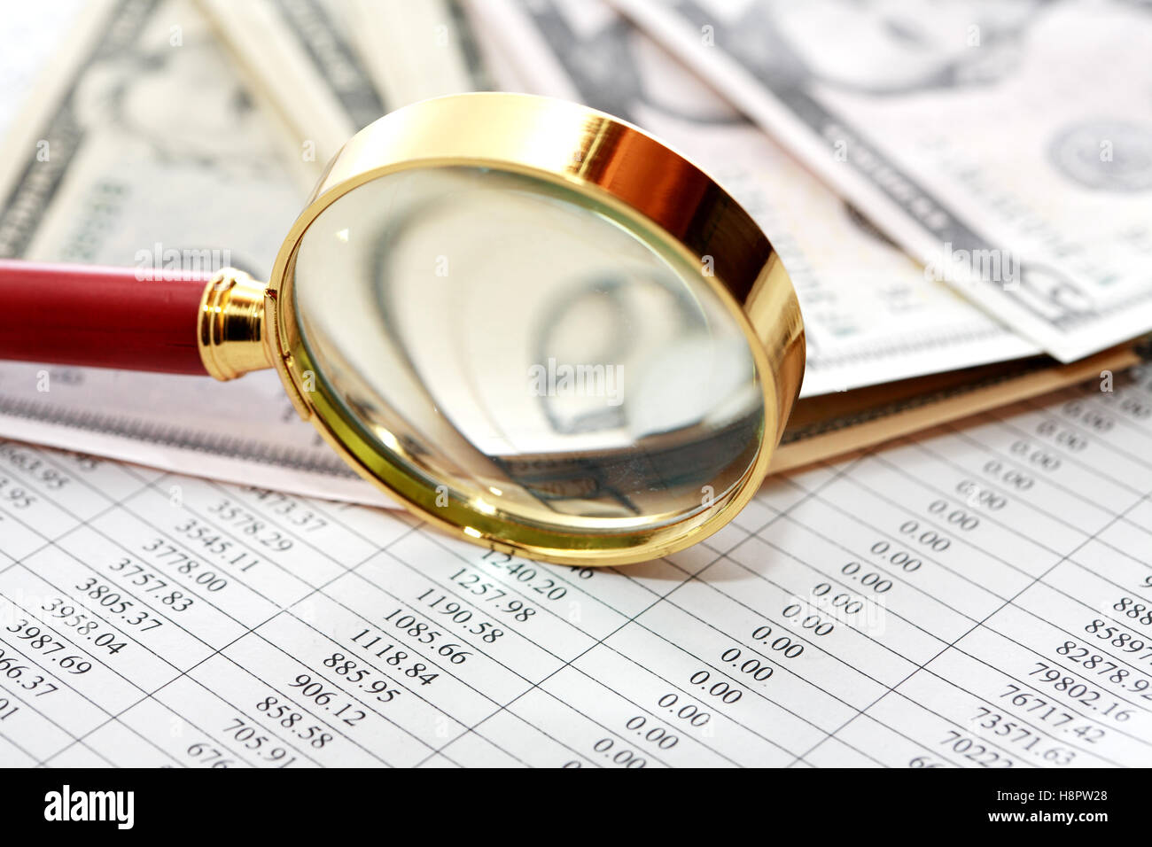 Magnifying glass near money on paper background with digits Stock Photo ...